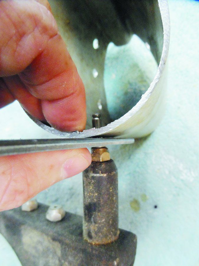 How to Tap and Rivet Into A Sailboat Spar - Practical Sailor